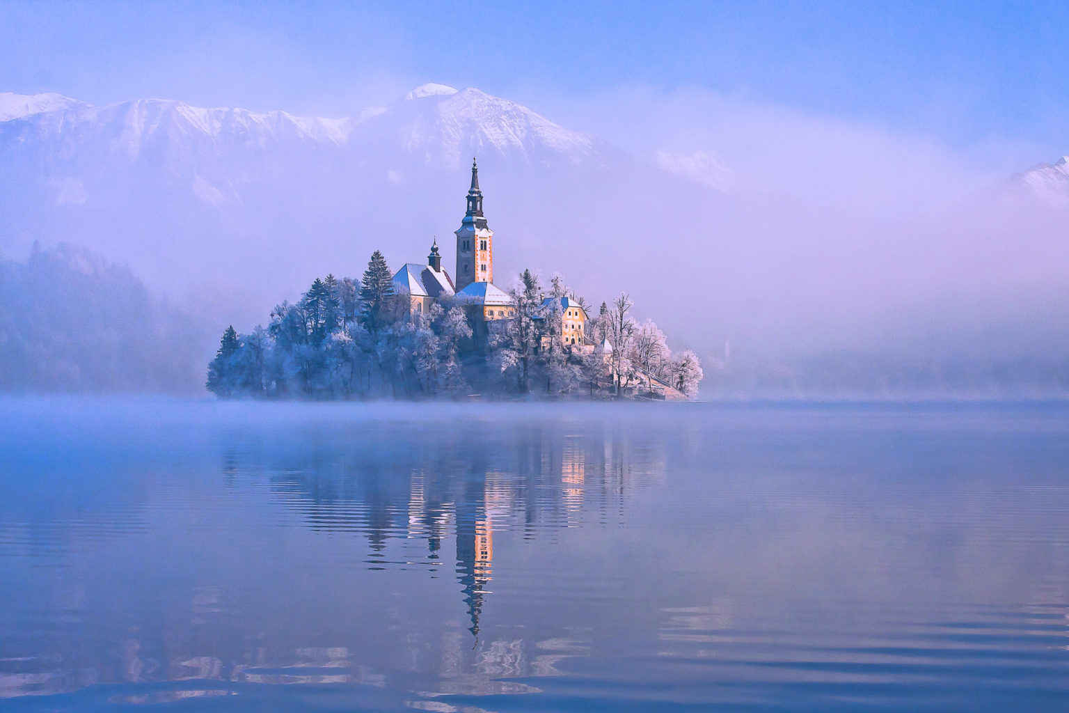 Photo Gallery: Lake Bled draped in winter white in the winter
